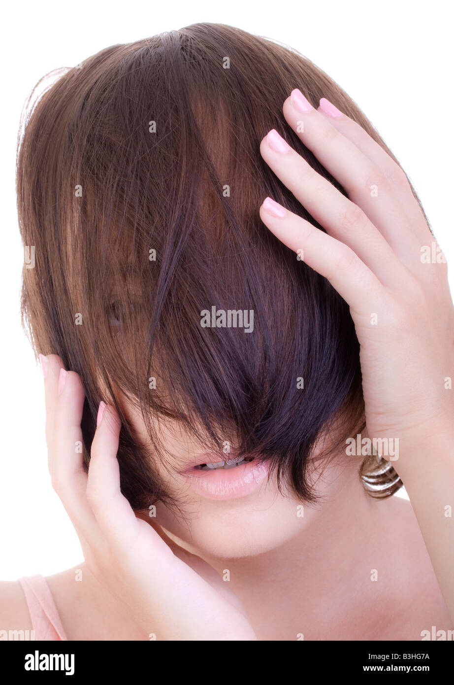 beautiful young woman has covered the face with her hair Stock Photo ...
