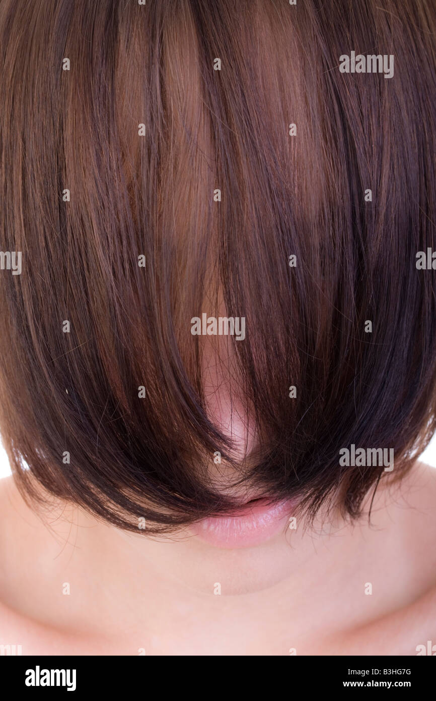 beautiful young woman has covered the face with her hair Stock Photo ...