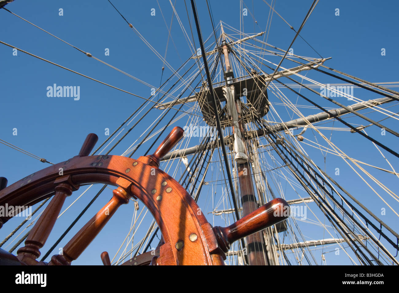 Wheel, masts, and rigging of an old tall sailing ship Stock Photo - Alamy
