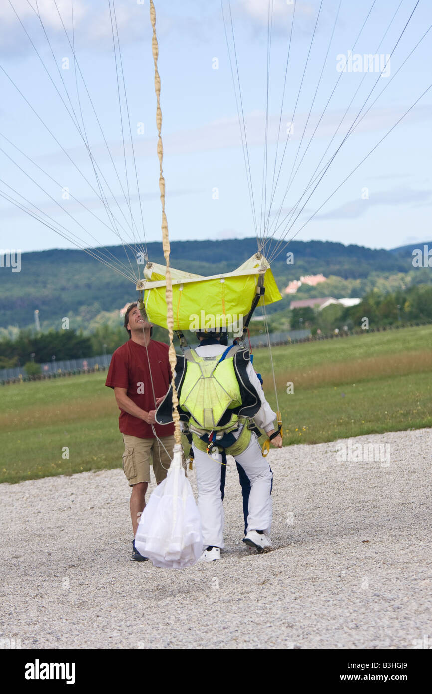 landing of a tandem parachutist Stock Photo - Alamy