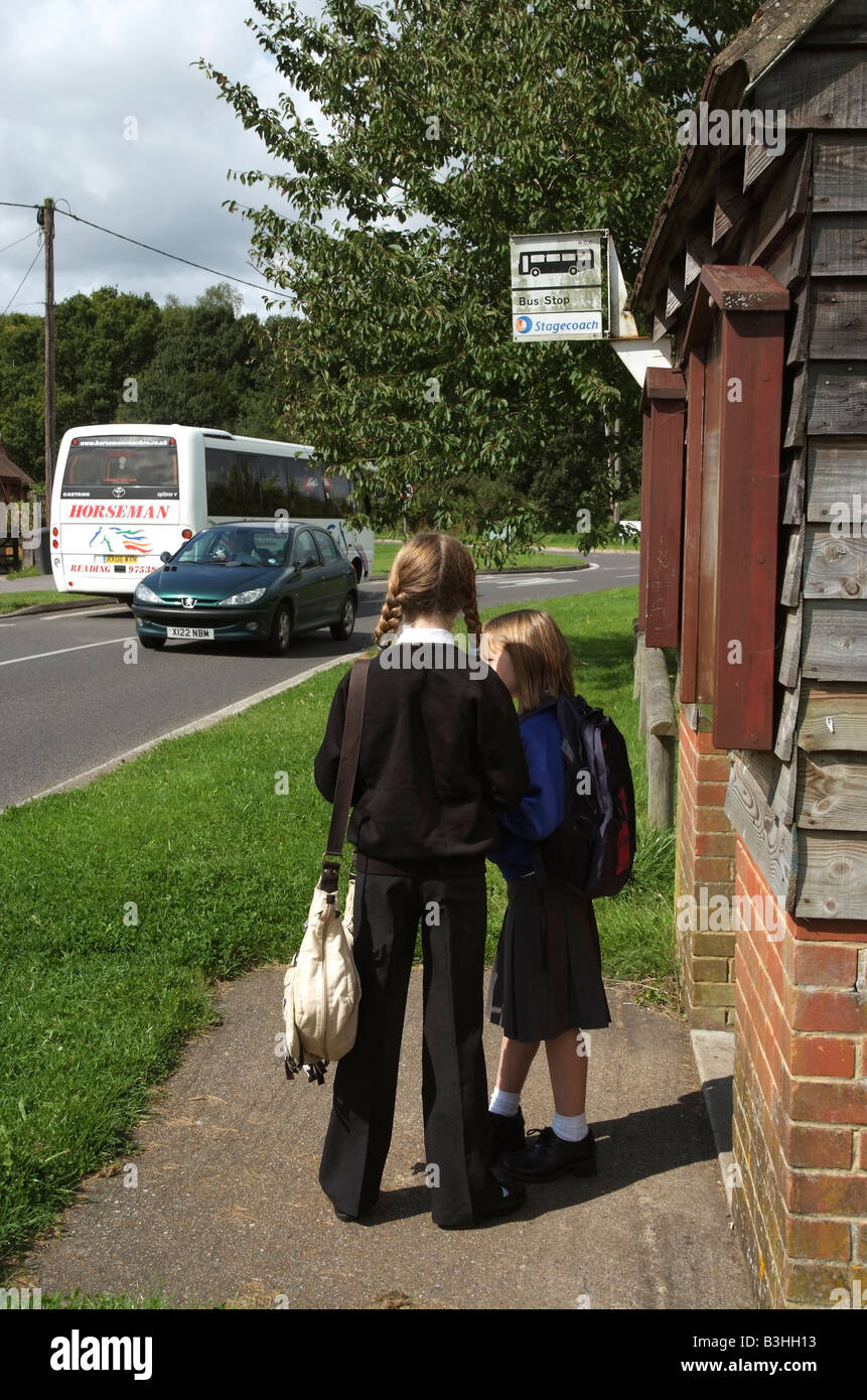 Children waiting at bus stop outside a bus shelter Stock Photo - Alamy