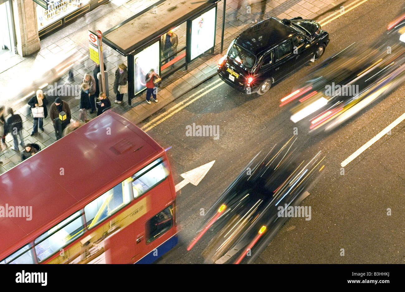 Bus stop at night's rush hour Stock Photo - Alamy