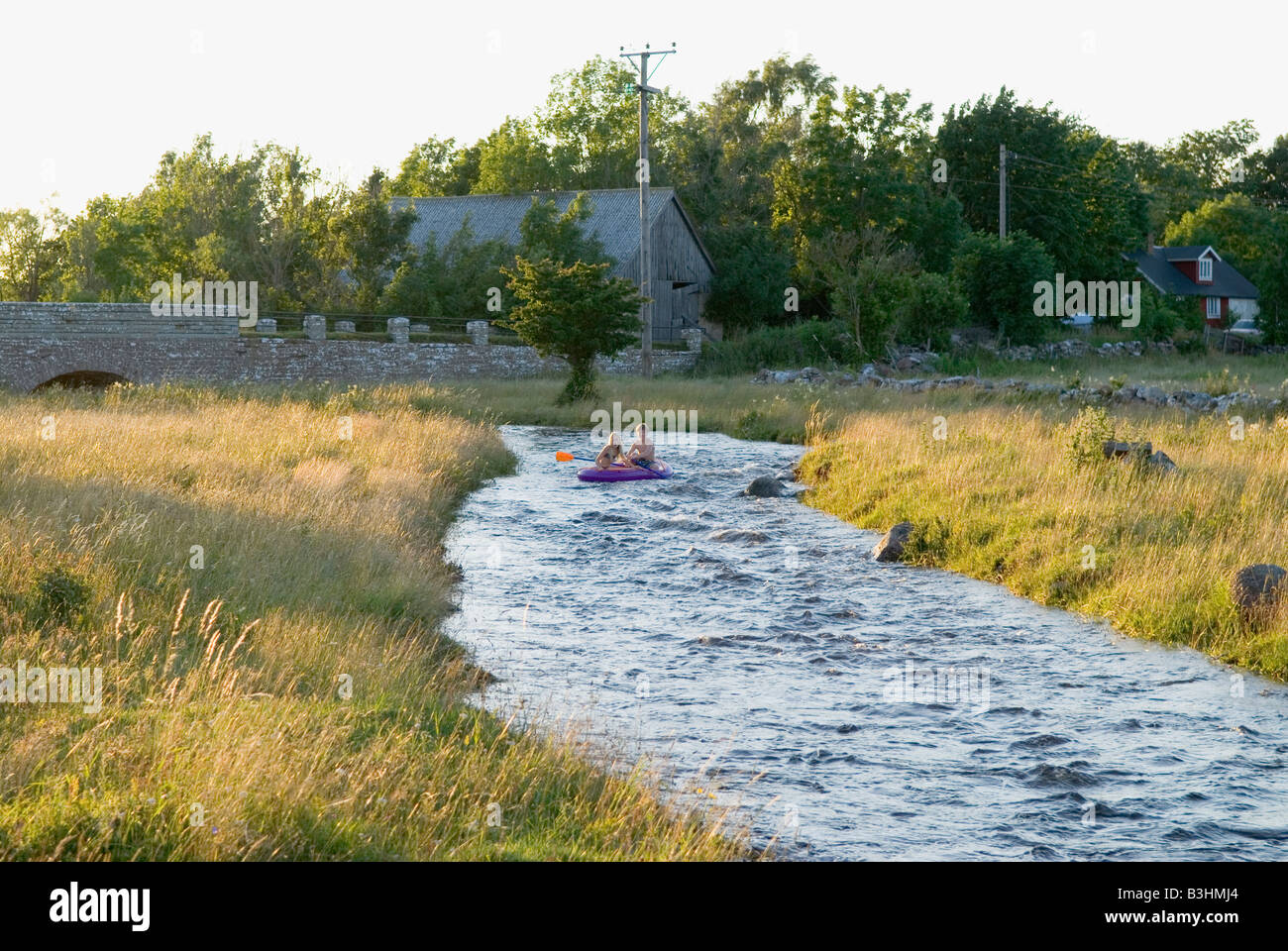 Girl playing with a toy boat hi-res stock photography and images - Alamy