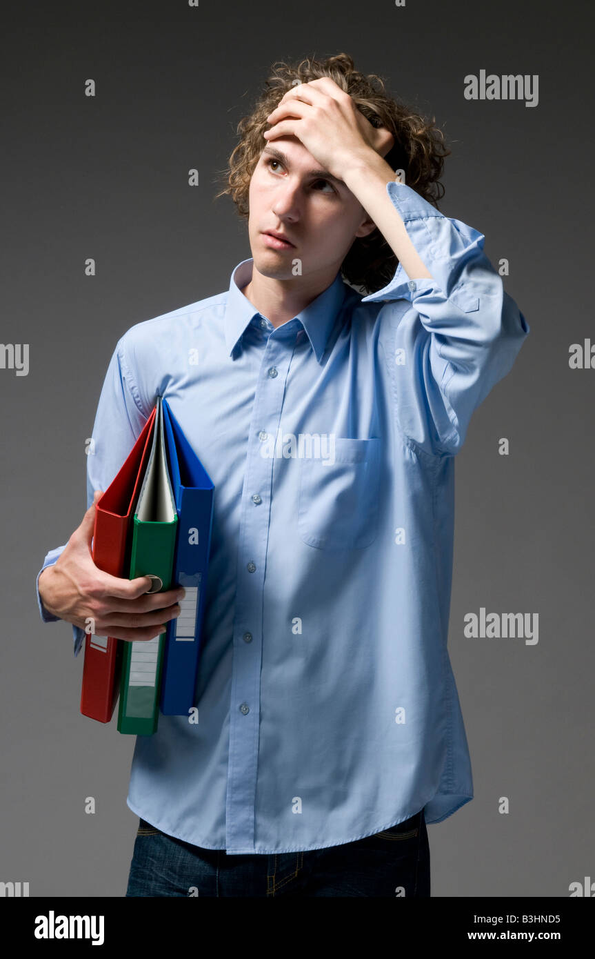 Young man with files on his head Stock Photo - Alamy