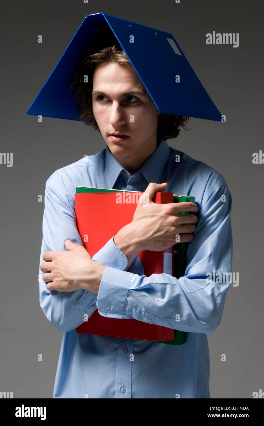 Young man with files on his head Stock Photo - Alamy