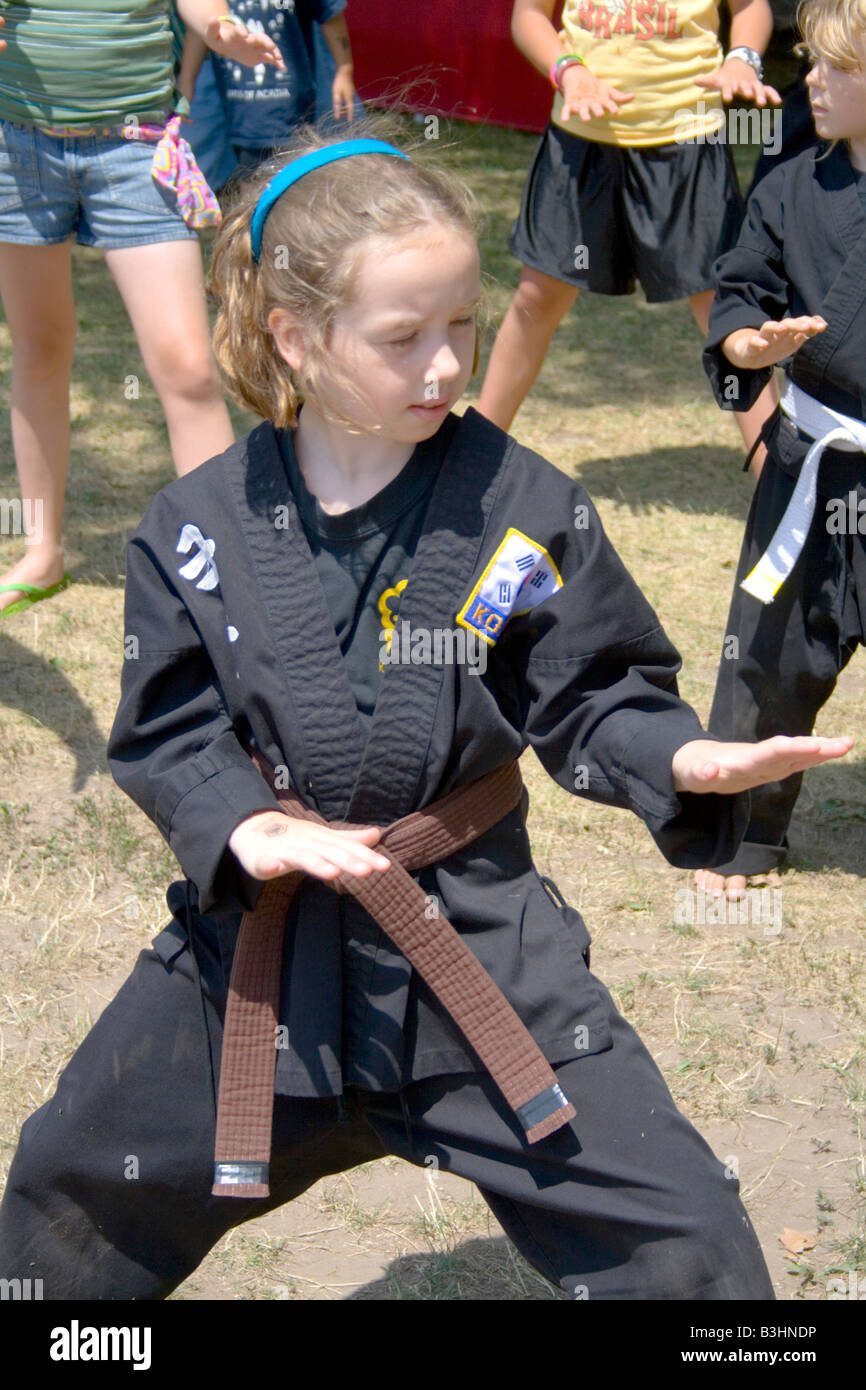 Young girl member of Kuk Sool Won school teaching martial arts. Dragon ...
