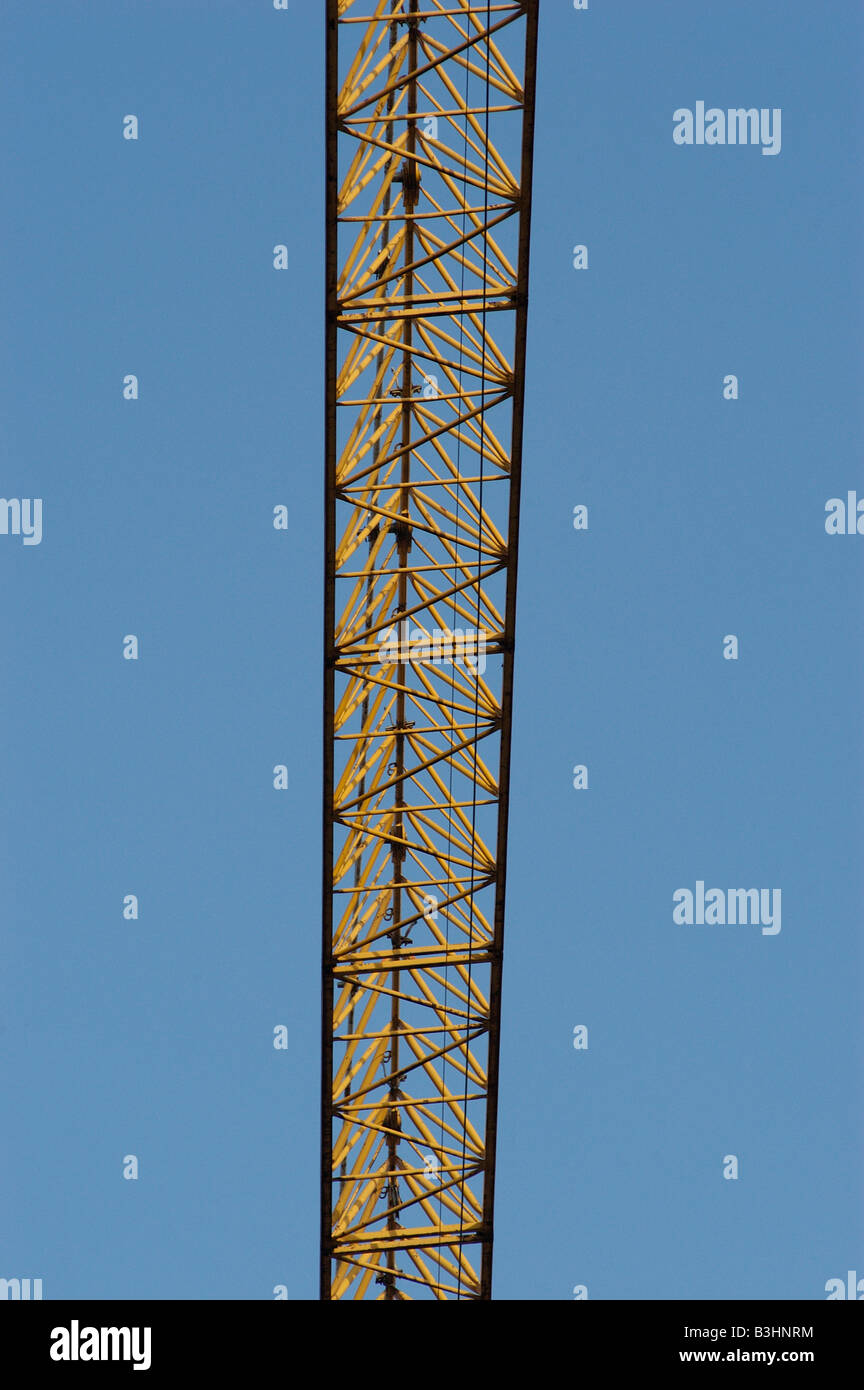 Construction crane in front of blue sky Stock Photo - Alamy