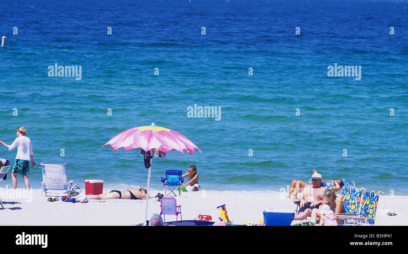 Summer beach on Cape Cod with blue green water and pink and white ...