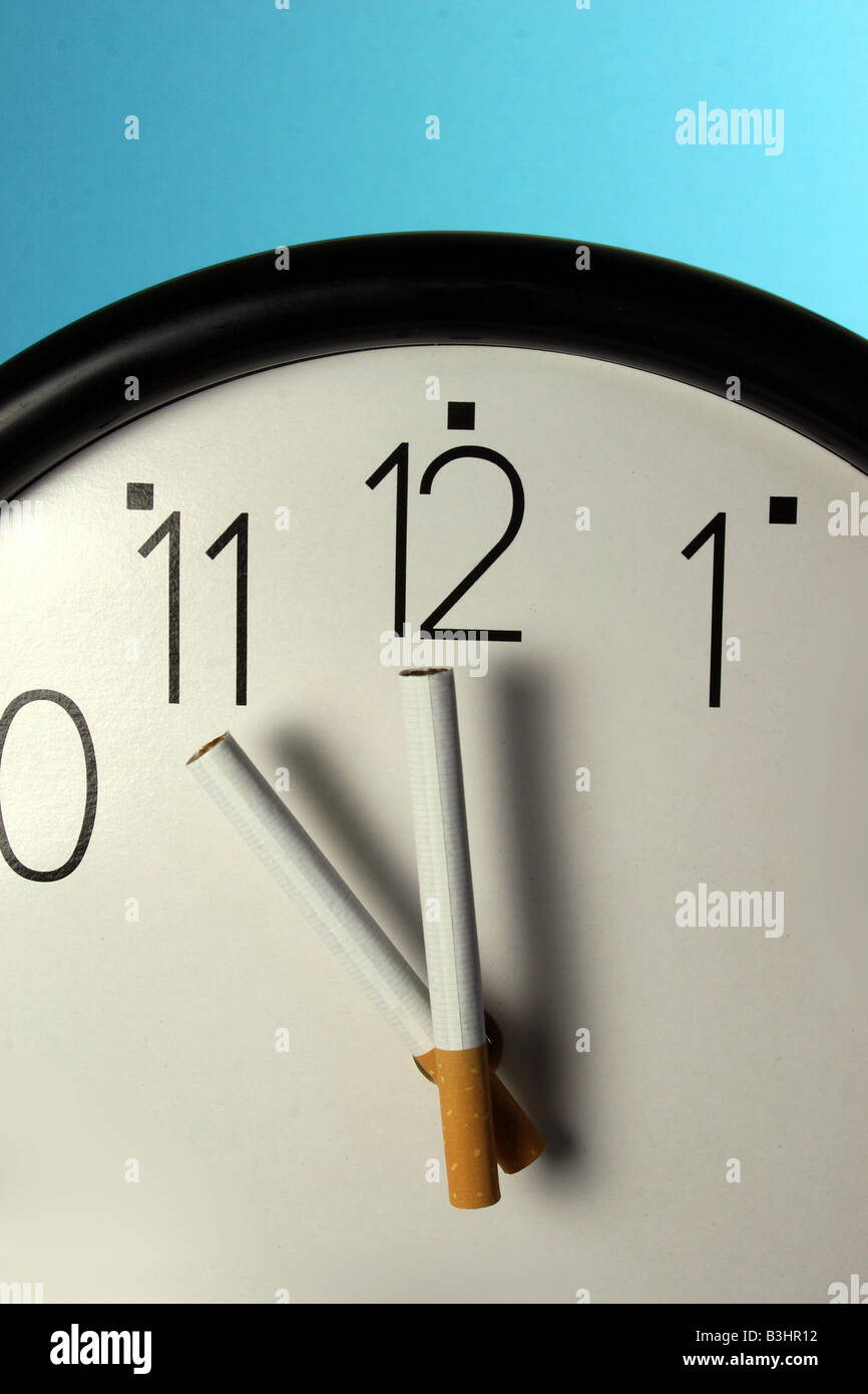 cigarettes and a clock Stock Photo - Alamy