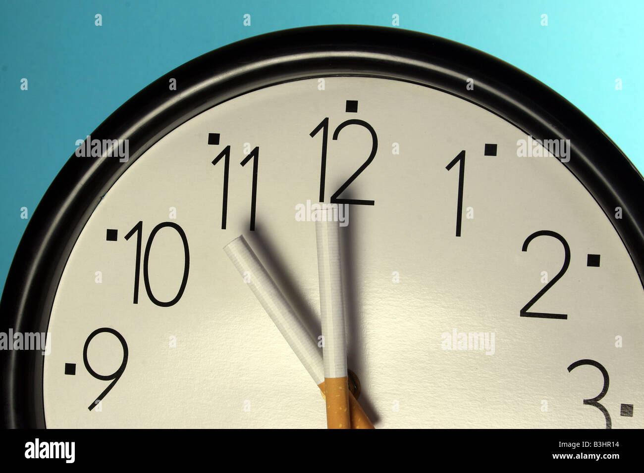 cigarettes and a clock Stock Photo - Alamy