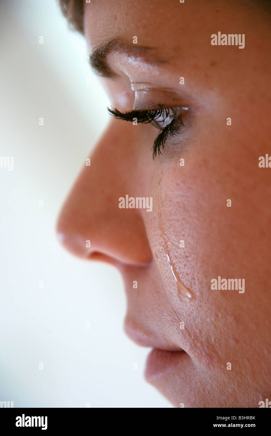 Woman with tear Stock Photo - Alamy