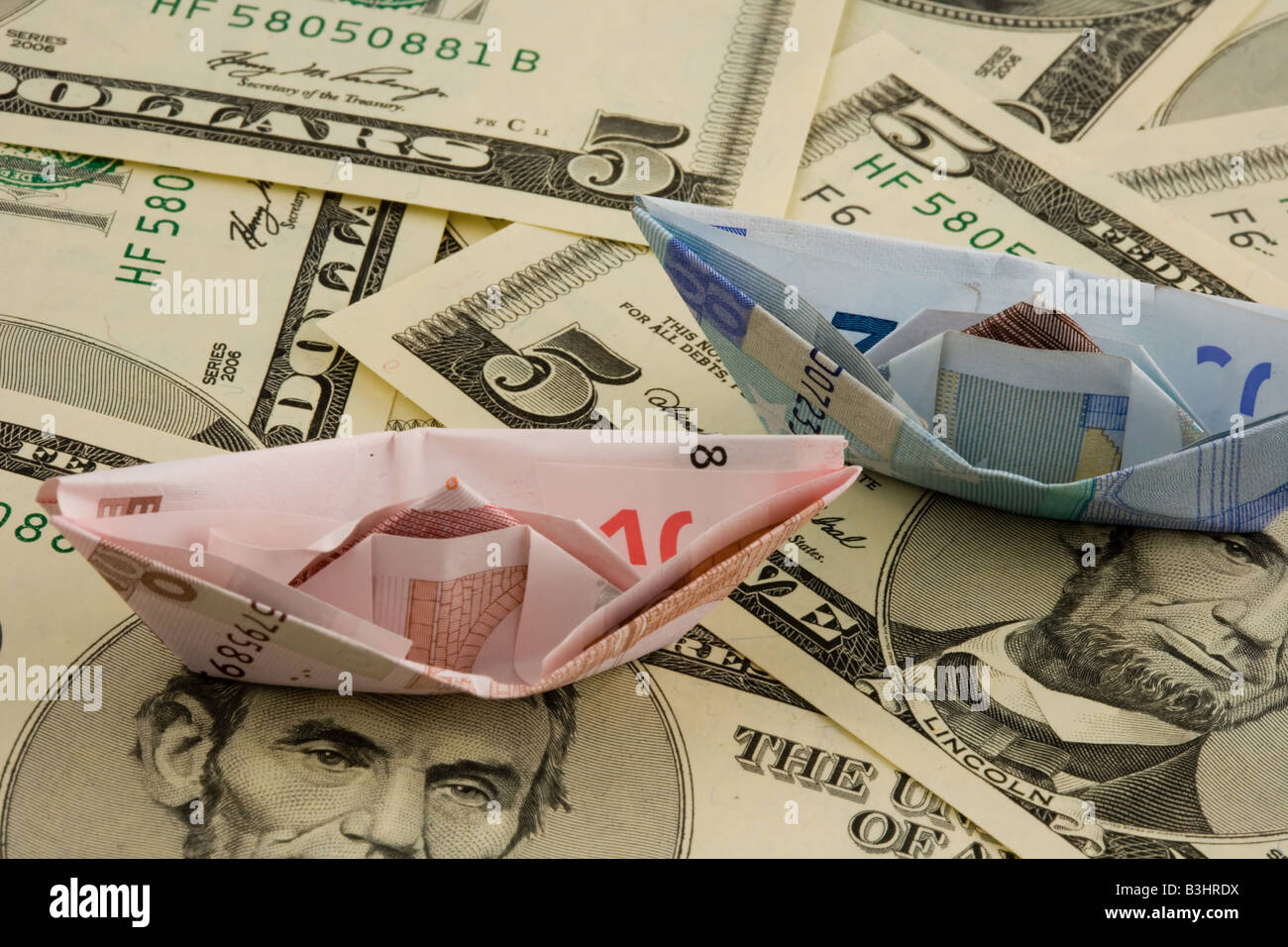 Dollar banknotes and euro ships Stock Photo - Alamy
