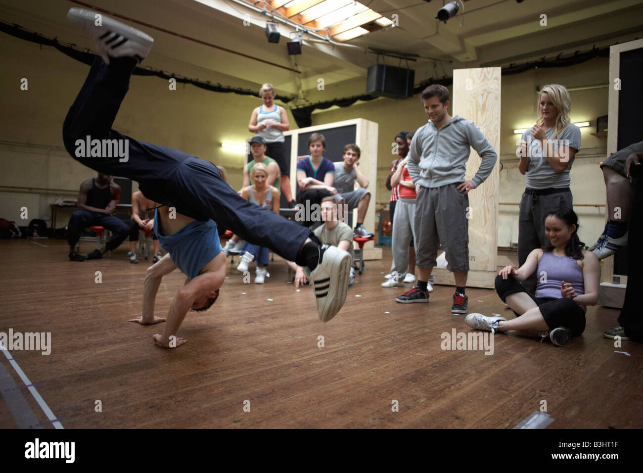 Cast members of High School Musical rehearse their song and dance ...