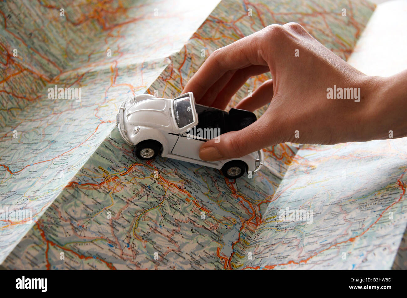 a midget-car, VW Beetle cabriolet, on a map Stock Photo - Alamy