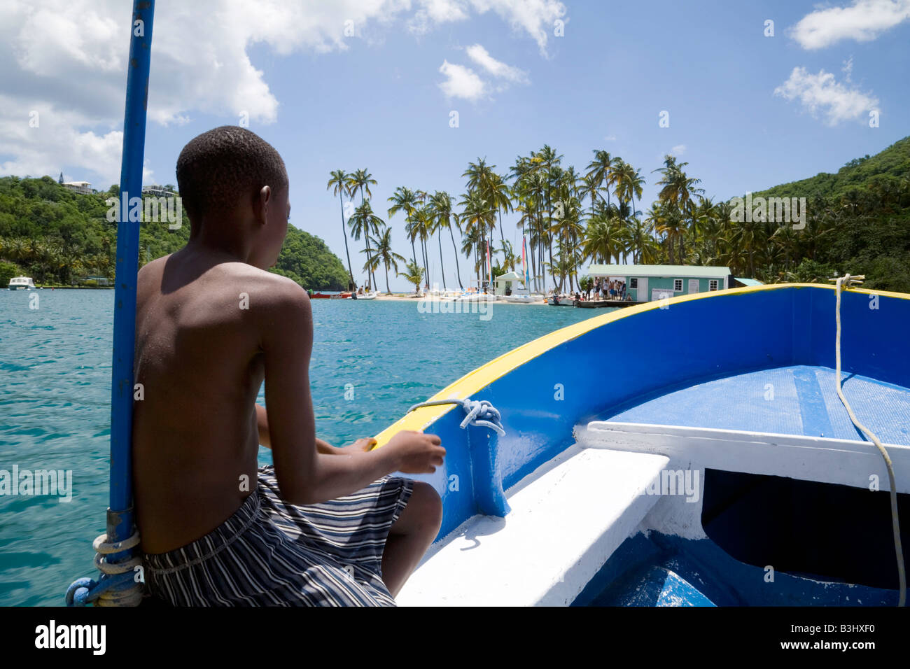 A local St Lucian boy rides the ferry, Marigot Bay, St Lucia, "West ...