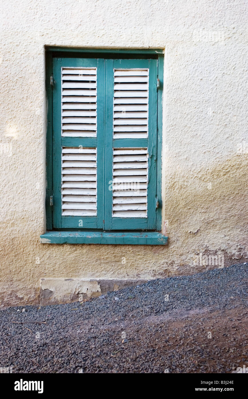 Turquoise and white shuttered window Stock Photo - Alamy