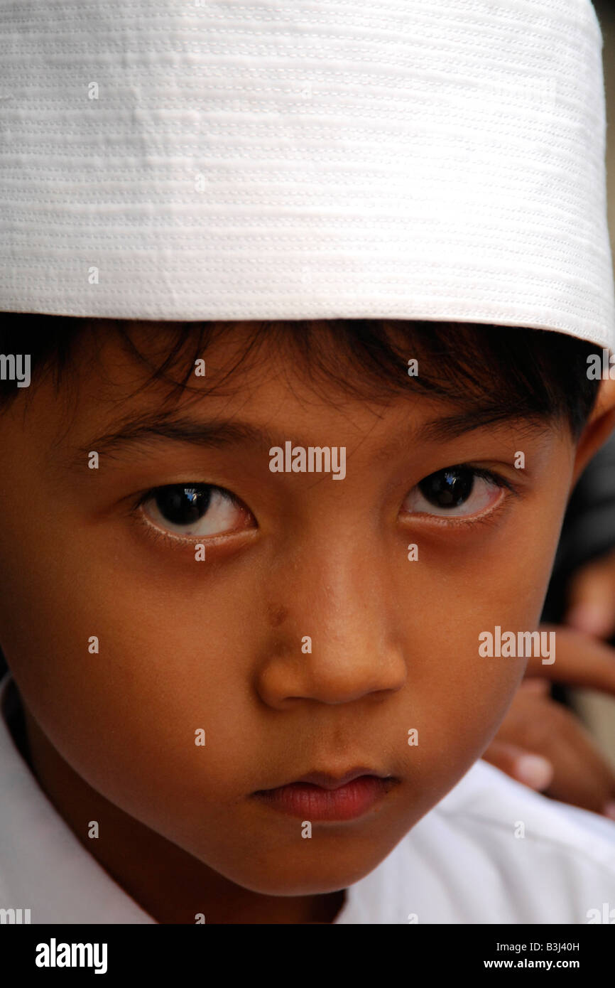 muslim boy at islamic school in muslim neighbourhood , kuta , bali ...