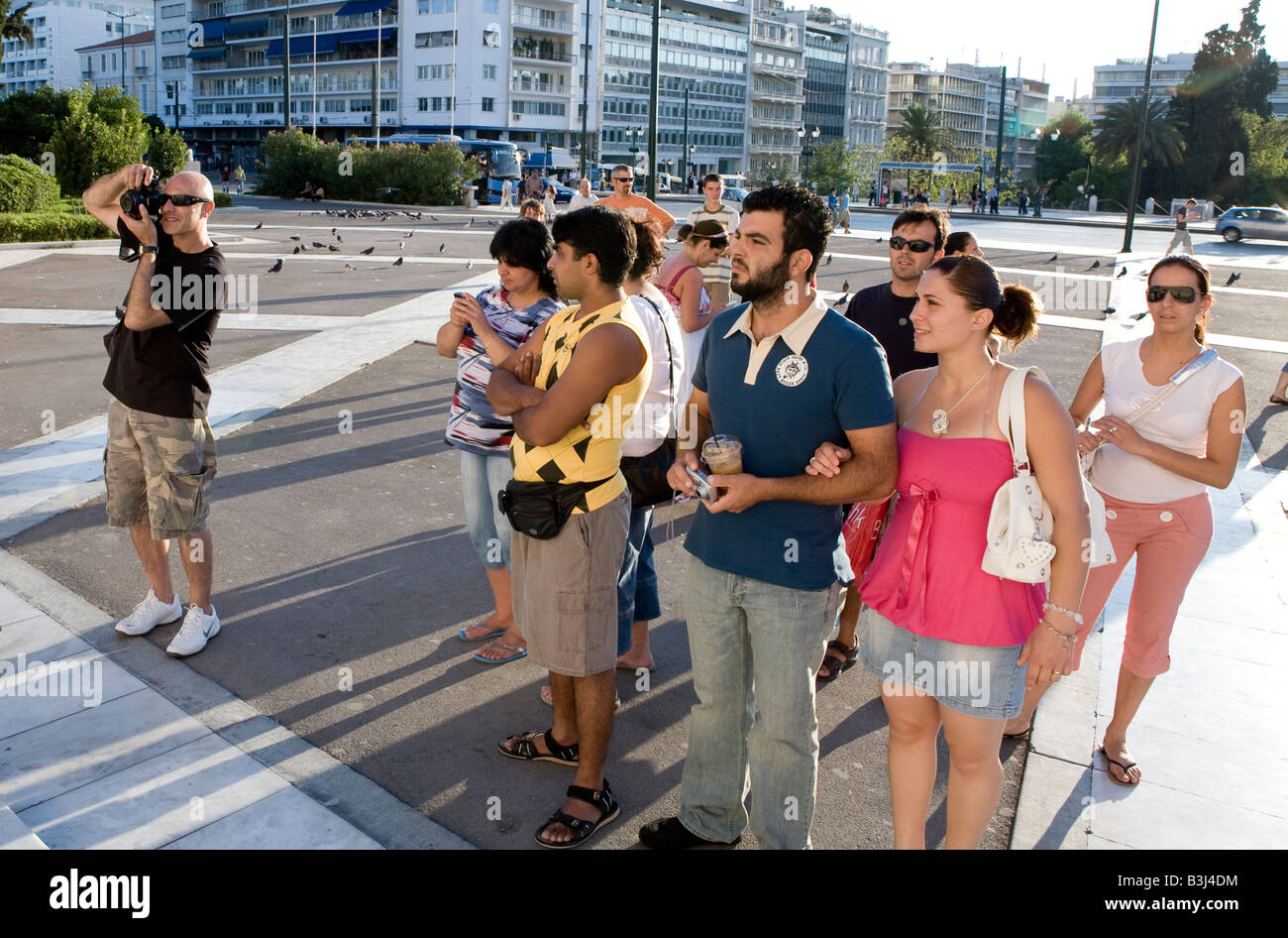Tourists watching traditional Evzon Guard at Tomb Of The Unknown ...