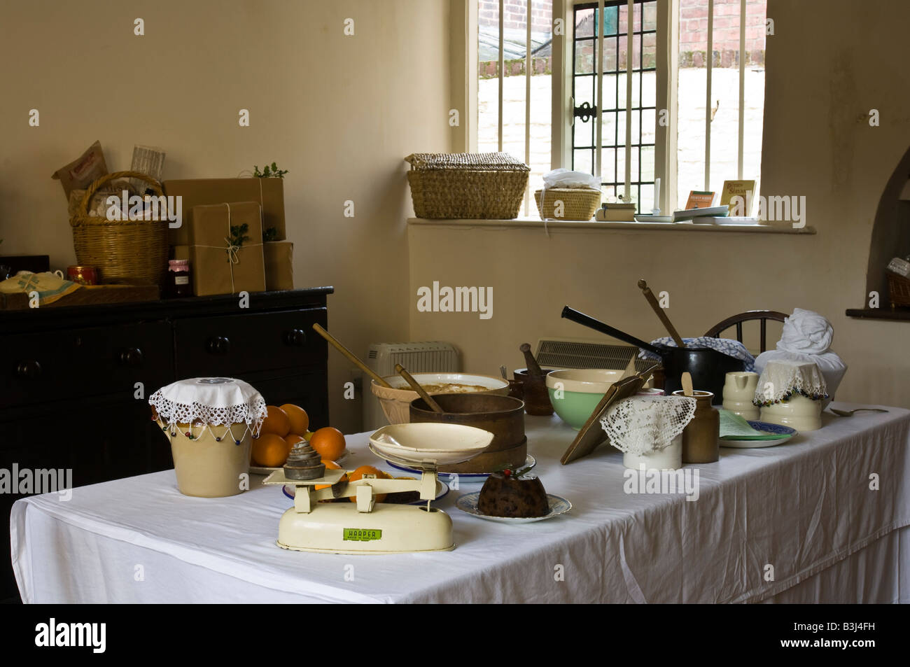 A table full of baking and cooking utensils ingredients in a Victorian ...
