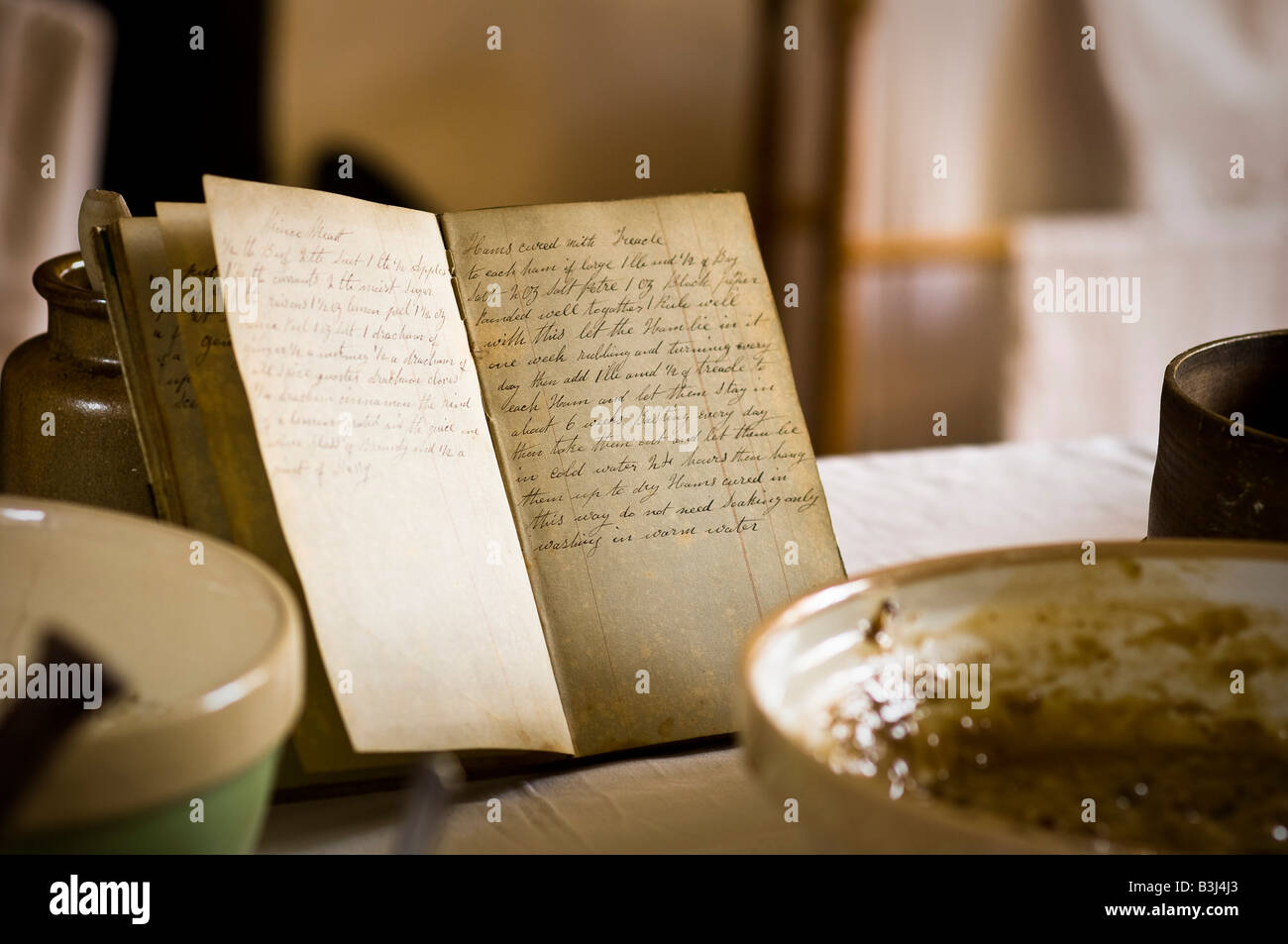 A hand-written recipe book (cookbook) by a baking bowl in a Victorian ...