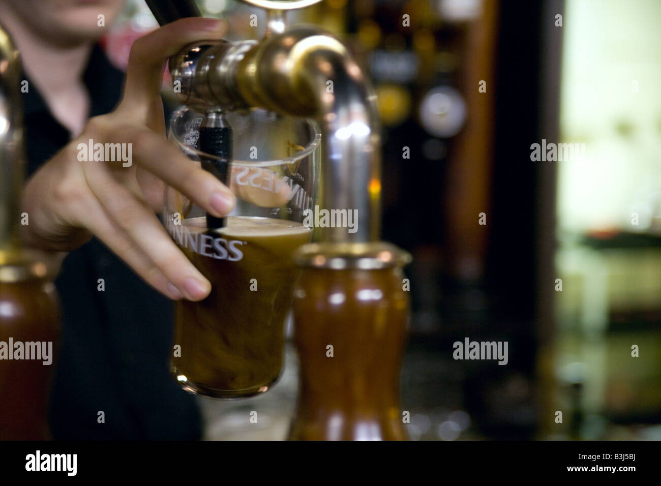 Man drinking guinness hi-res stock photography and images - Alamy