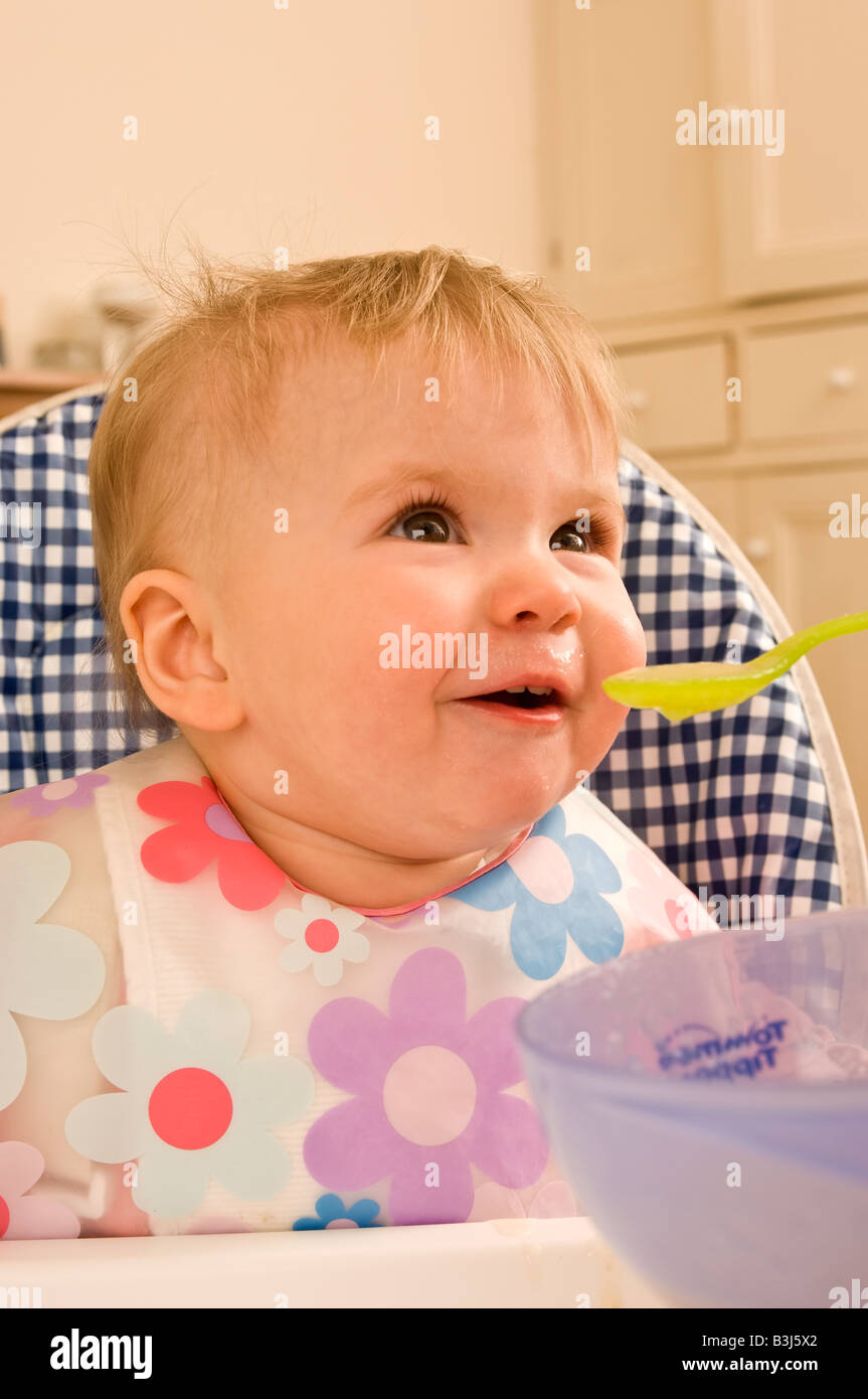baby girl being spoon fed Stock Photo - Alamy