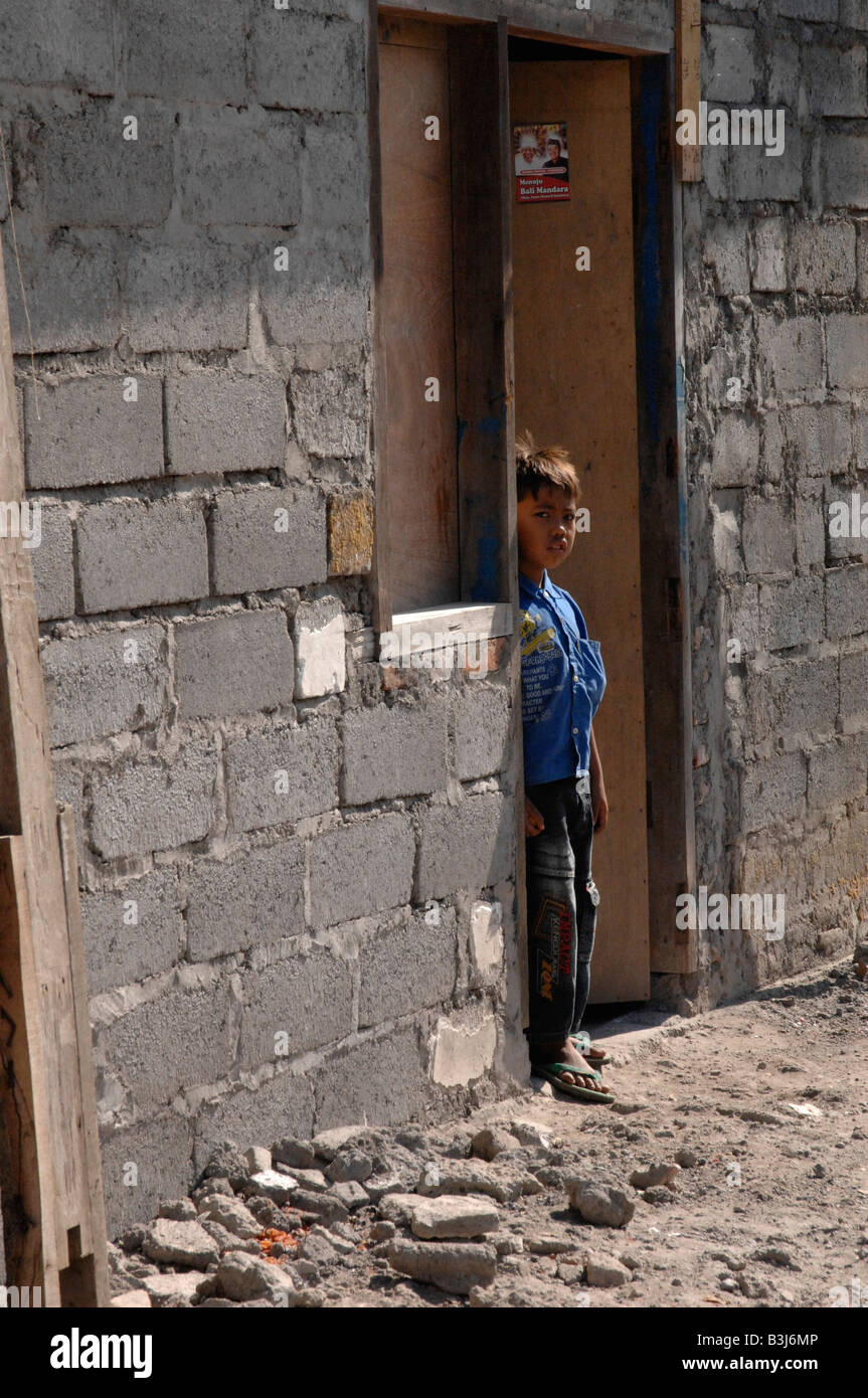 inquisitive boy ,slum in backstreets of kuta, bali, indonesia Stock ...