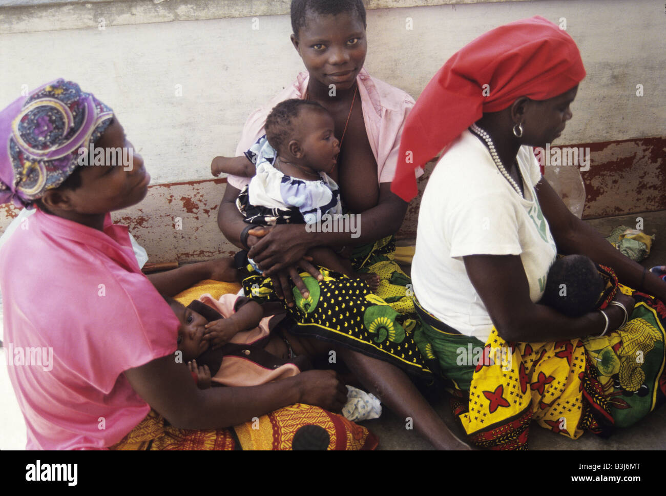 Mozambique 2001 Mothers and babies waiting at clinic Stock Photo - Alamy