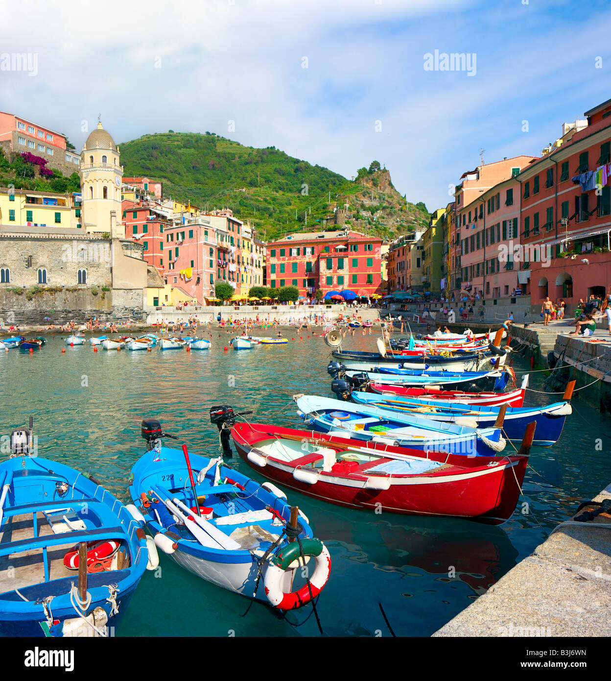 Fishing boats in the harbor of Vernazza, Italy. Within the group of ...
