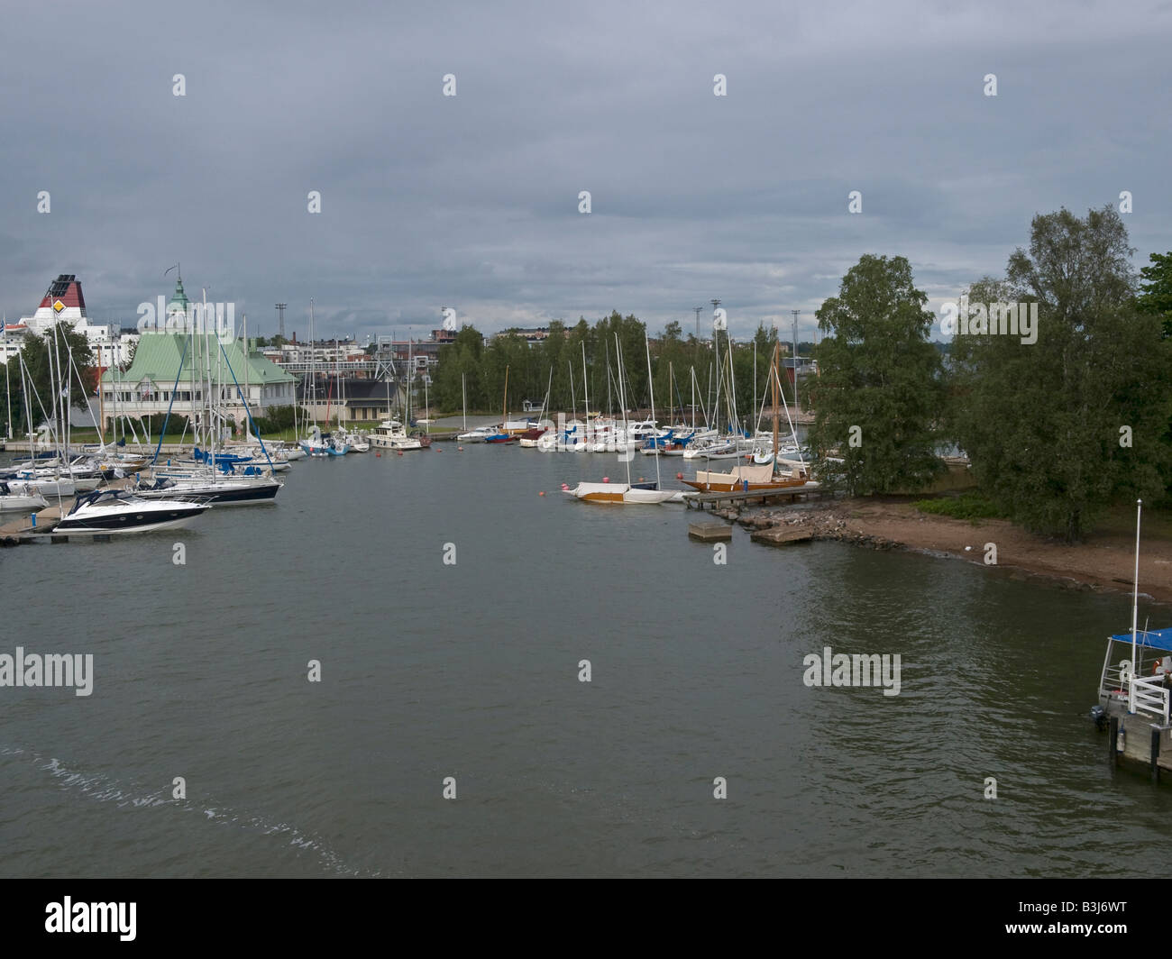 old timber wooden villa mansion and landing stage with boats on the ...
