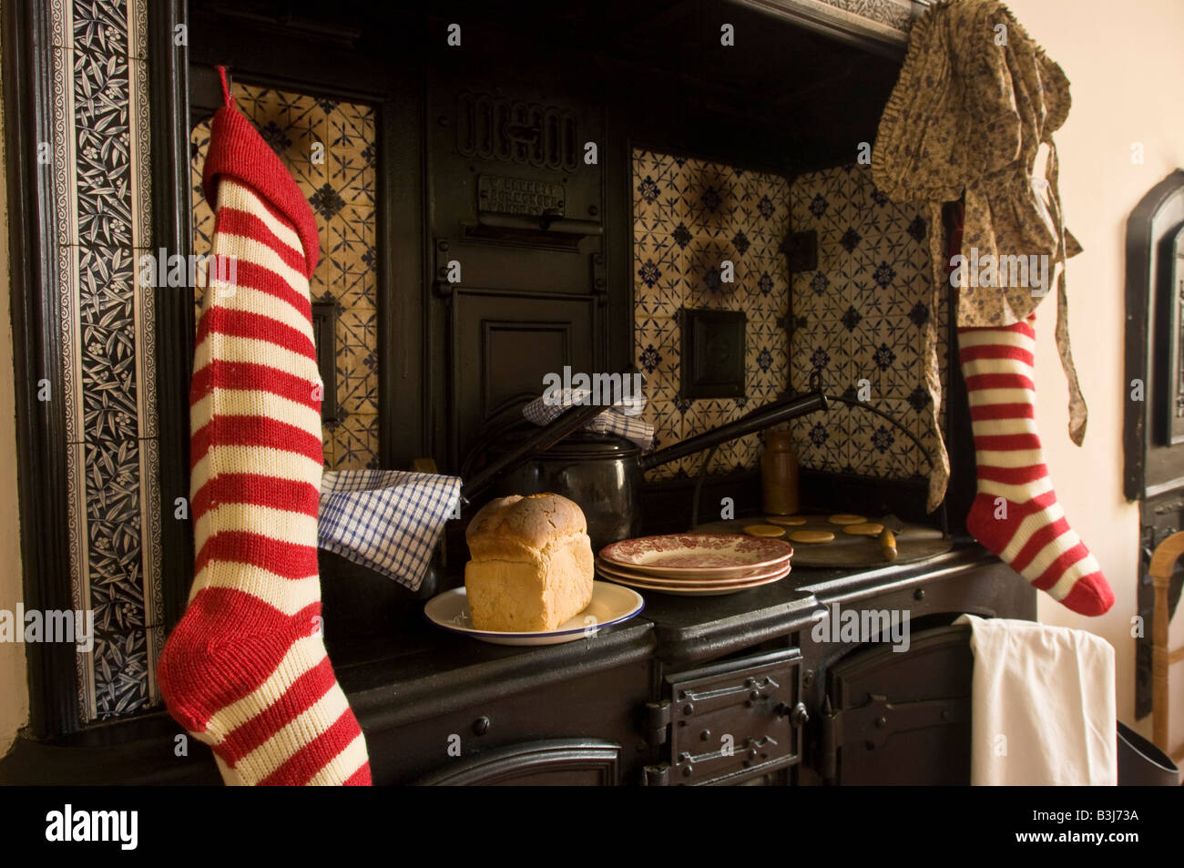 A traditional cast-iron cooker in a Victorian kitchen shown decorated ...