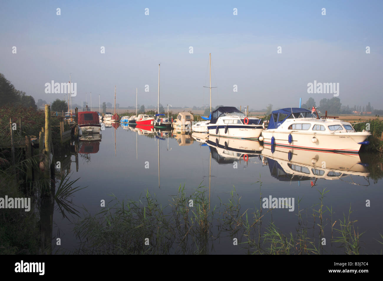Boats moored in Hardley Dike off the River Yare, Norfolk, UK, early ...