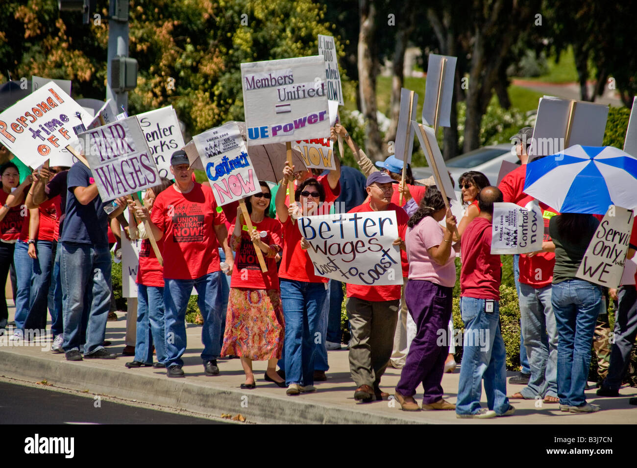 Union employees of U S government contractors picket for better pay and ...