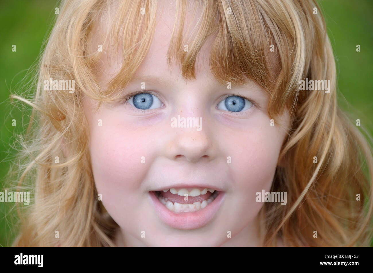 Cute little girl with blue eyes Stock Photo - Alamy