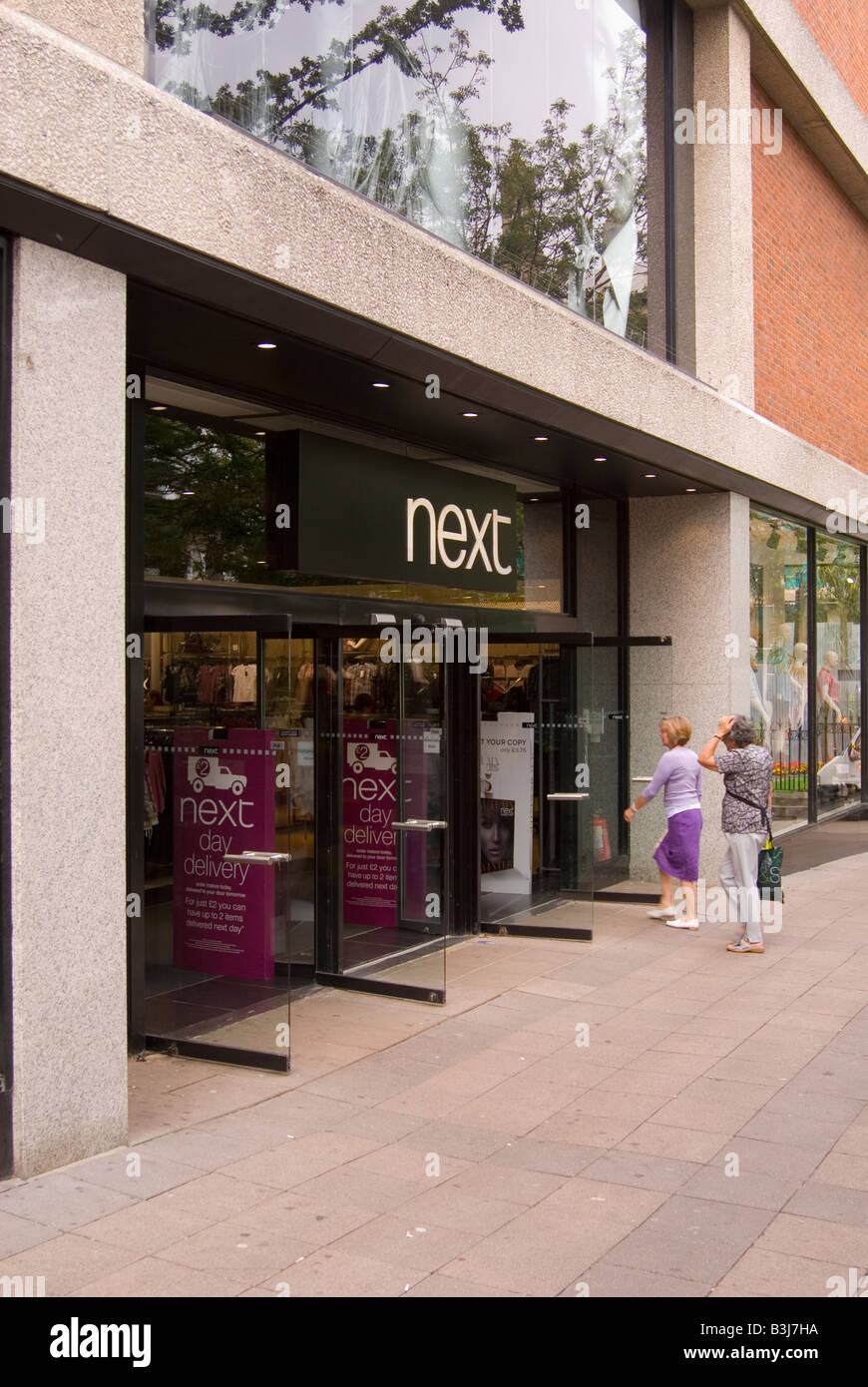 Two customers entering the Next store in Norwich,Norfolk,uk Stock Photo ...