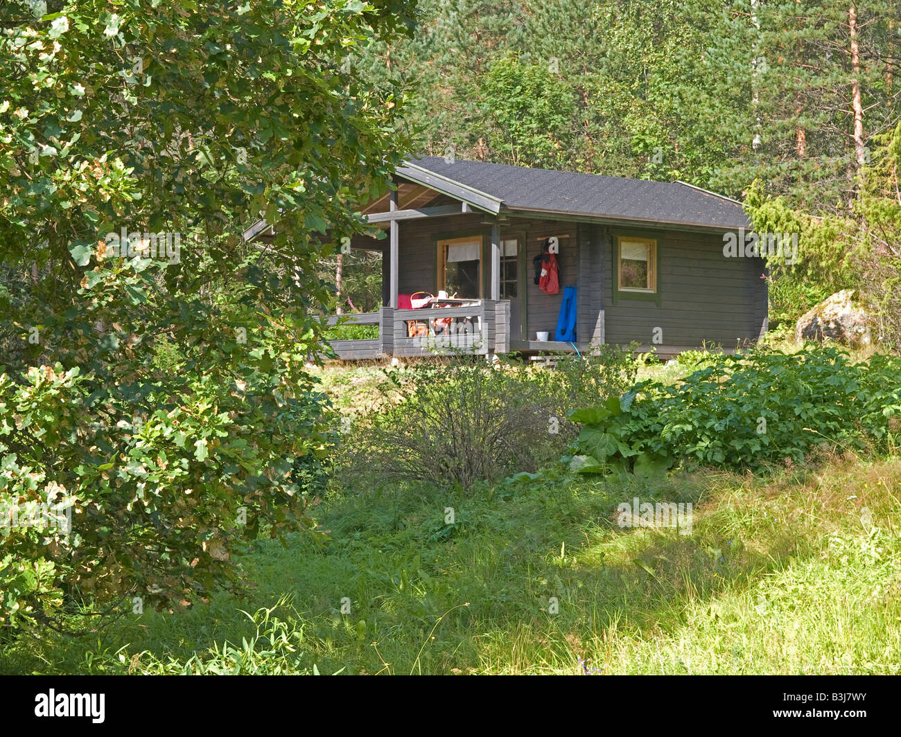 black block cabin timber wooden house in forest in Finland Stock Photo ...