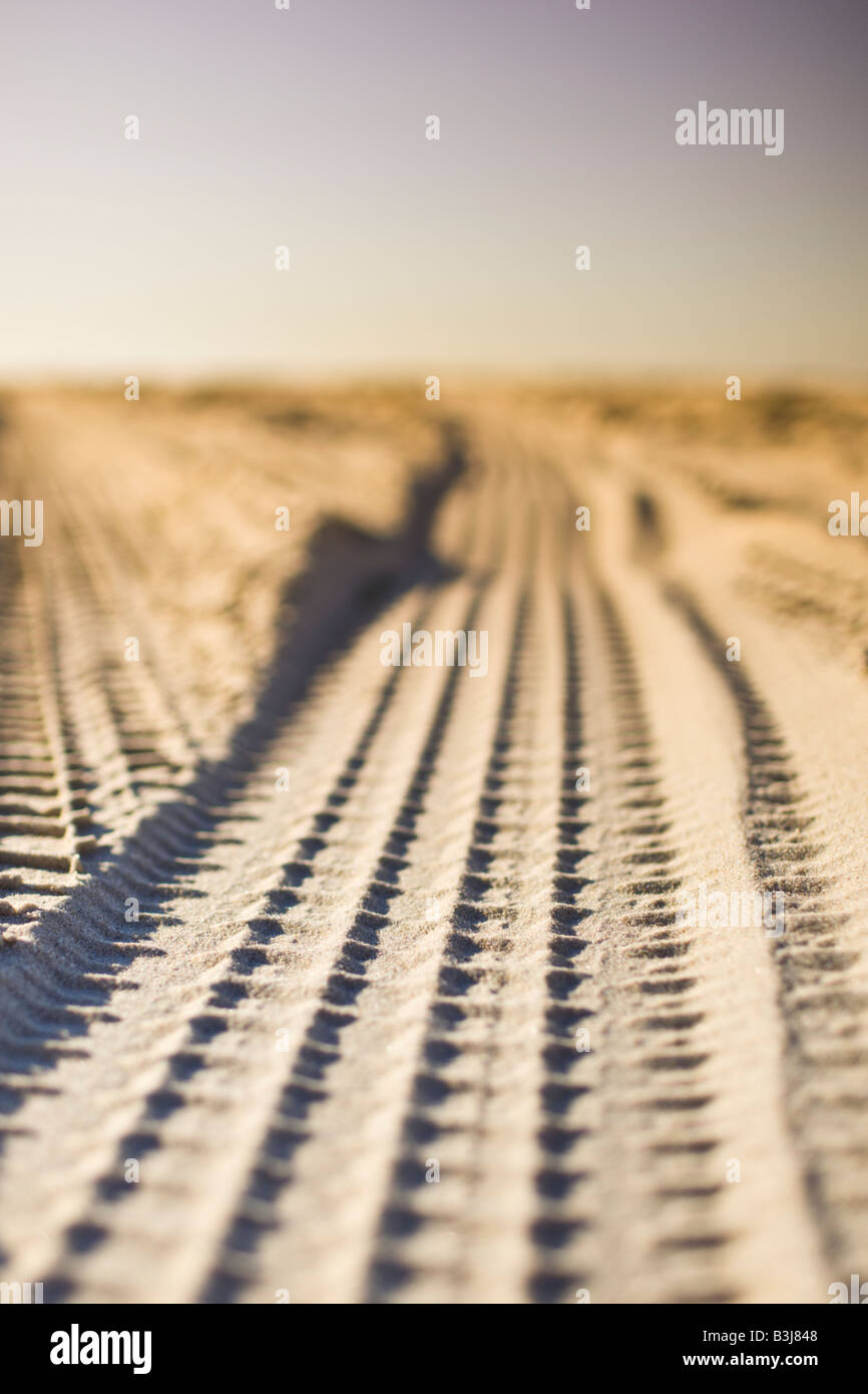 Close up of tire tracks in the sand. Tyre tread marks Stock Photo - Alamy