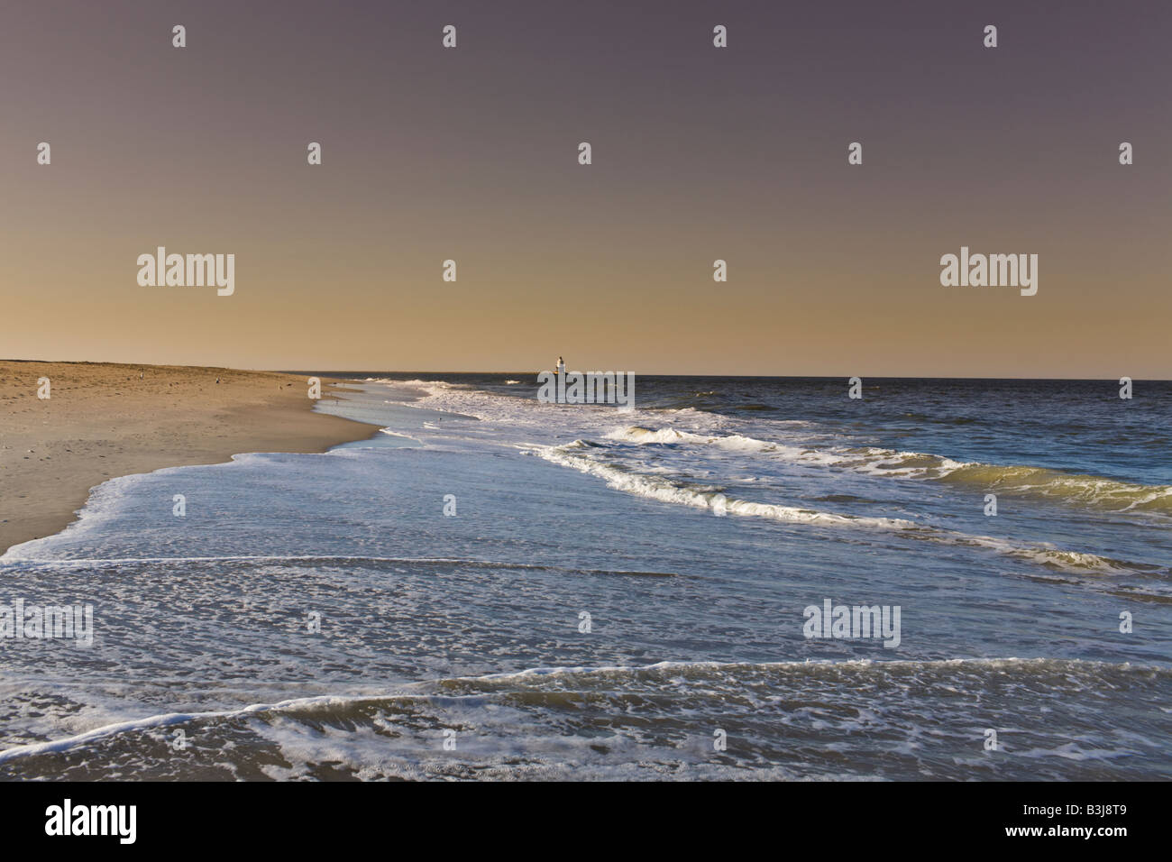 The Breakwater Lighthouse with waves crashing against the Delaware ...