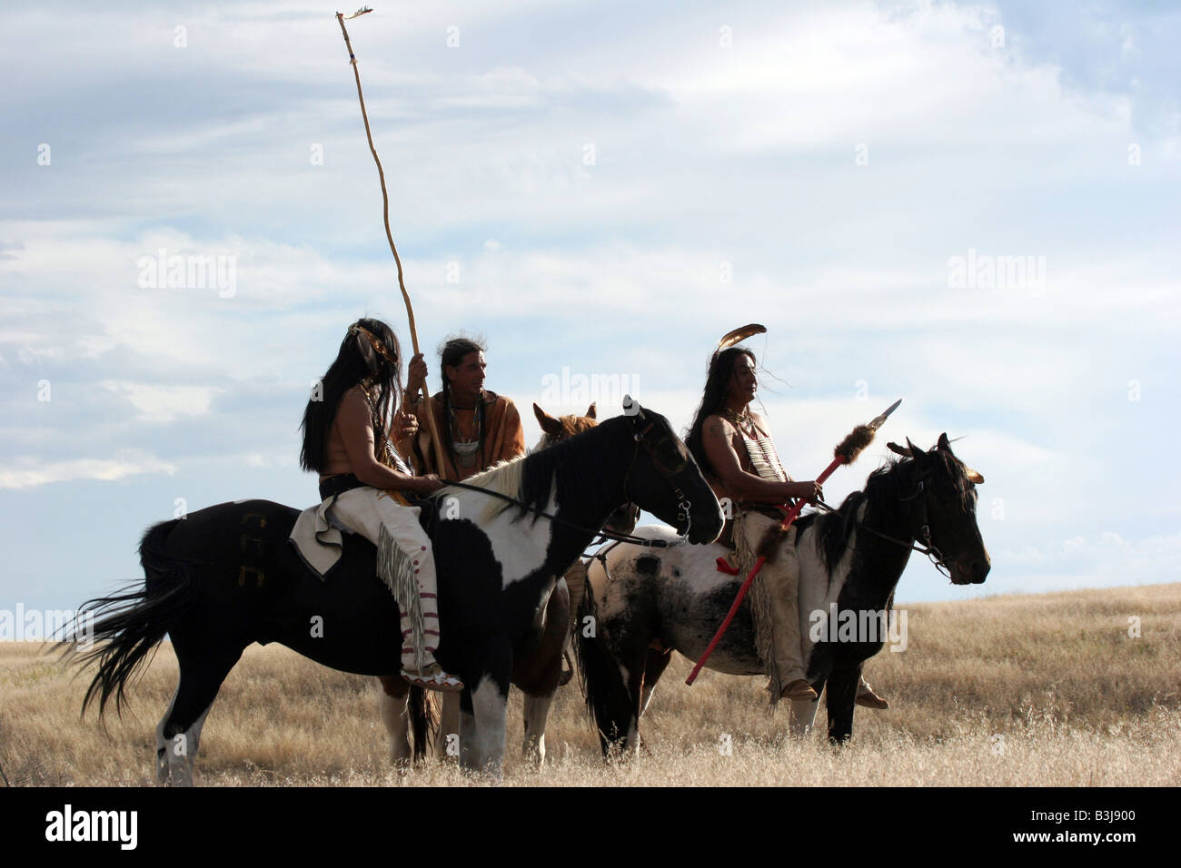 Three Native American Indians on horseback on the prairie of South ...