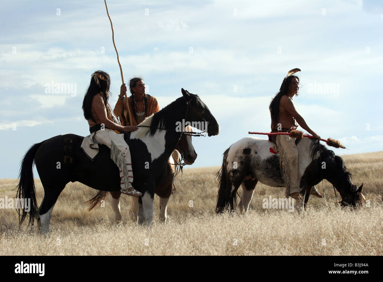Three Native American Indians on horseback on the prairie of South ...