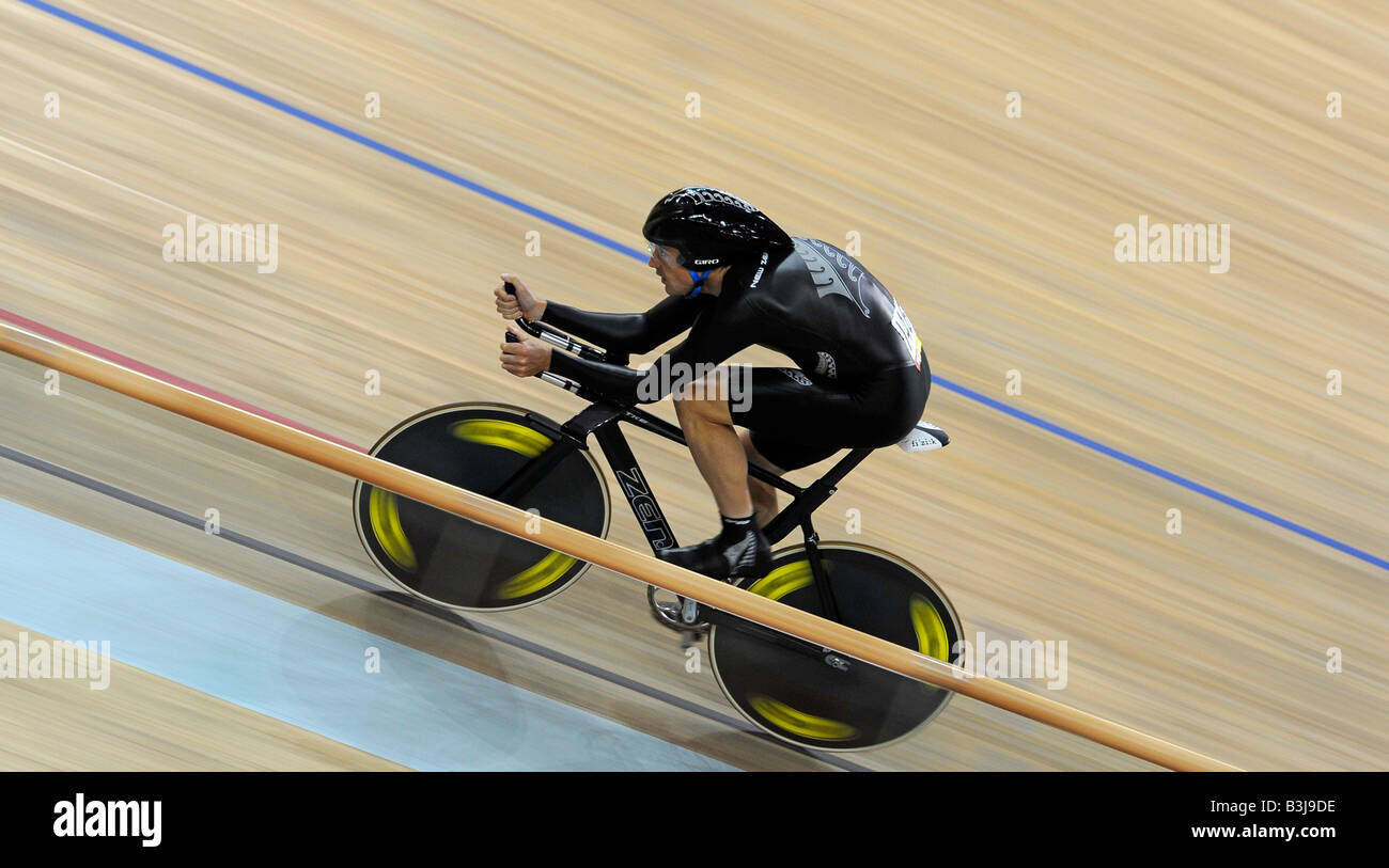 Rider competes in men individual pursuit cycling track race at the 2008 ...