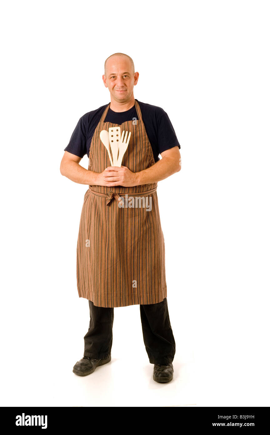 man in his 40 with apron and cooking utensils isolated on white Stock ...