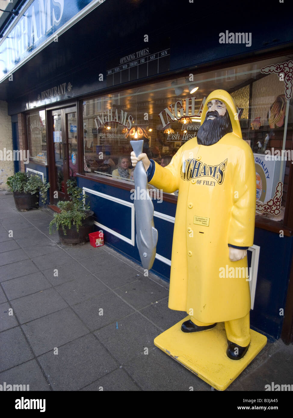 A yellow mannikin in the form of a fisherman in yellow oilskins at ...