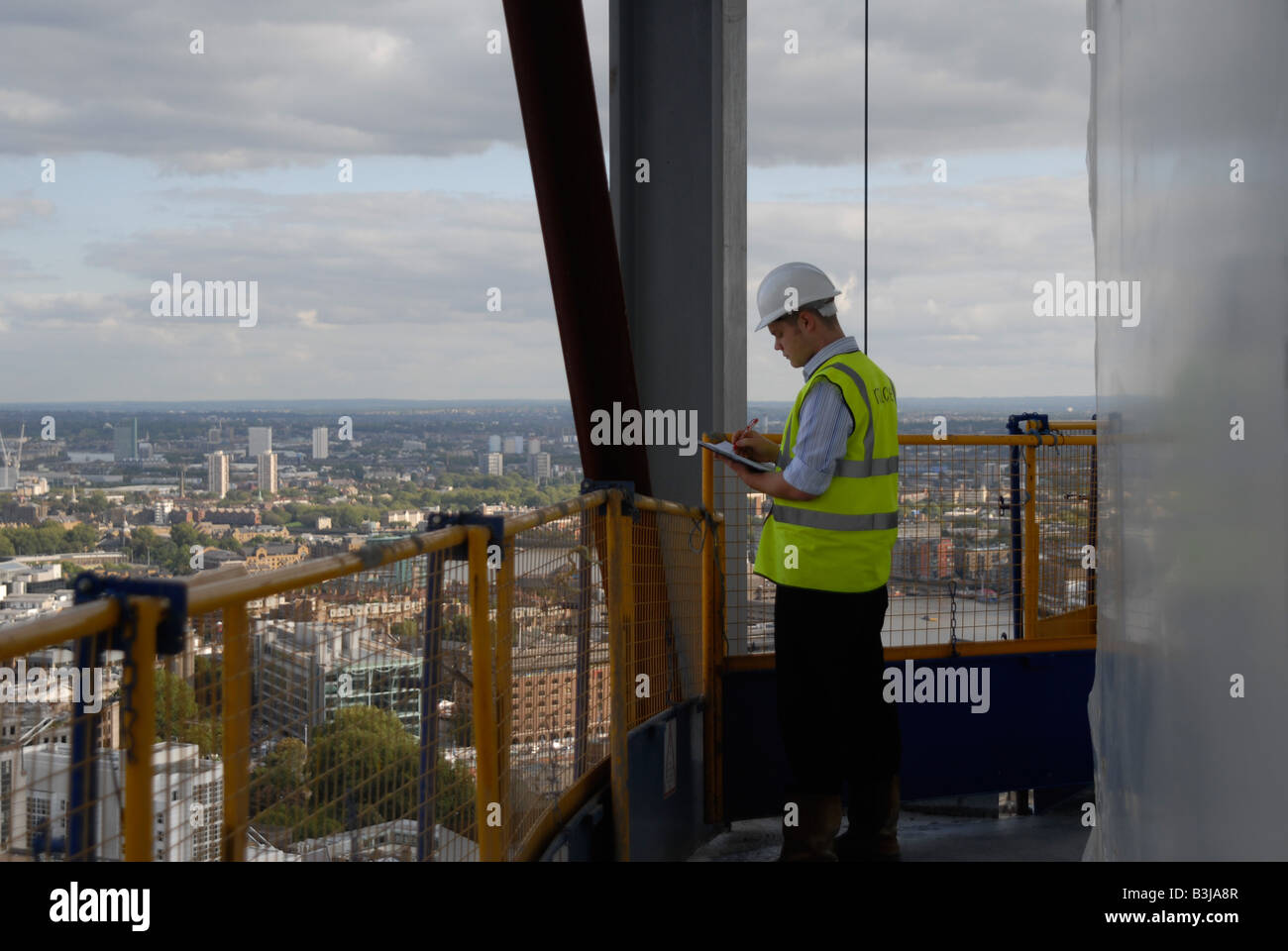 construction worker taking notes Stock Photo - Alamy