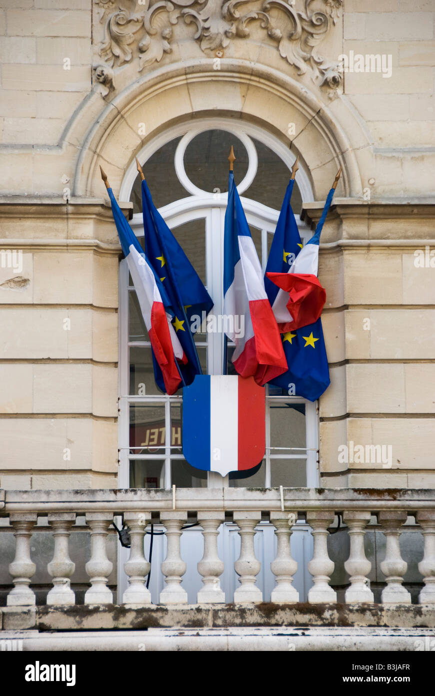 Coutances, Normandy, France. French and EU flags on the front of the ...