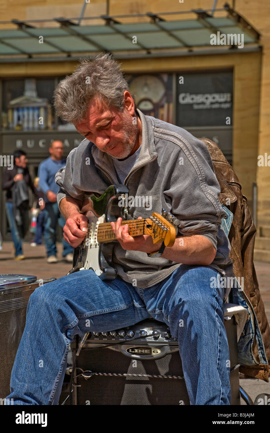 Busker street musician guitar player hi-res stock photography and ...
