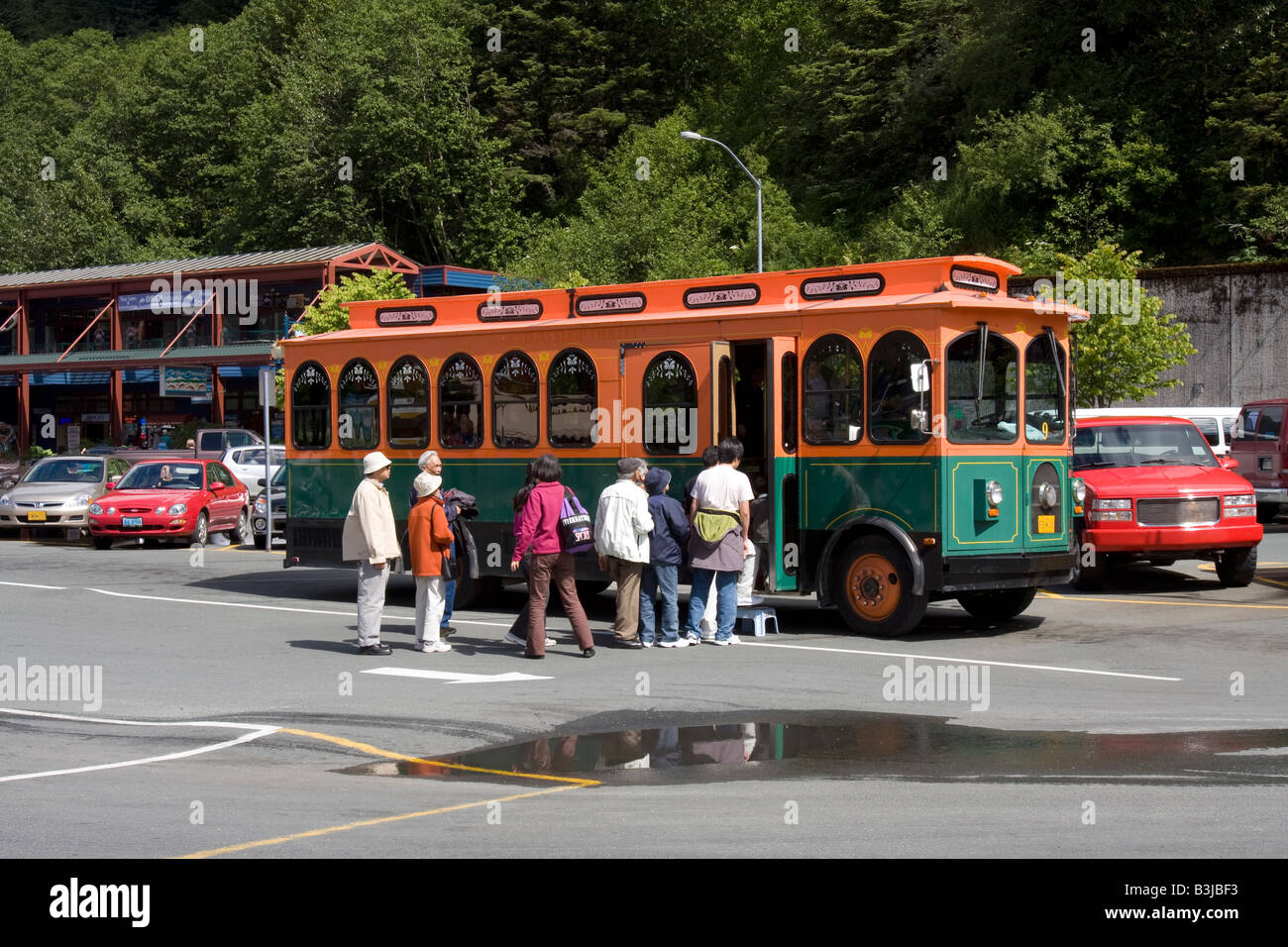 People getting onto the trolley bus near Mt Roberts Tram in down town ...
