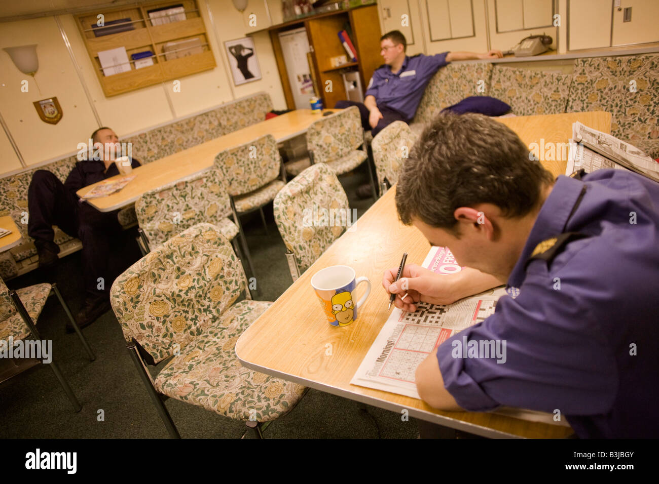 Royal Navy crew spend leisure time in the Junior Ratings wardroom ...