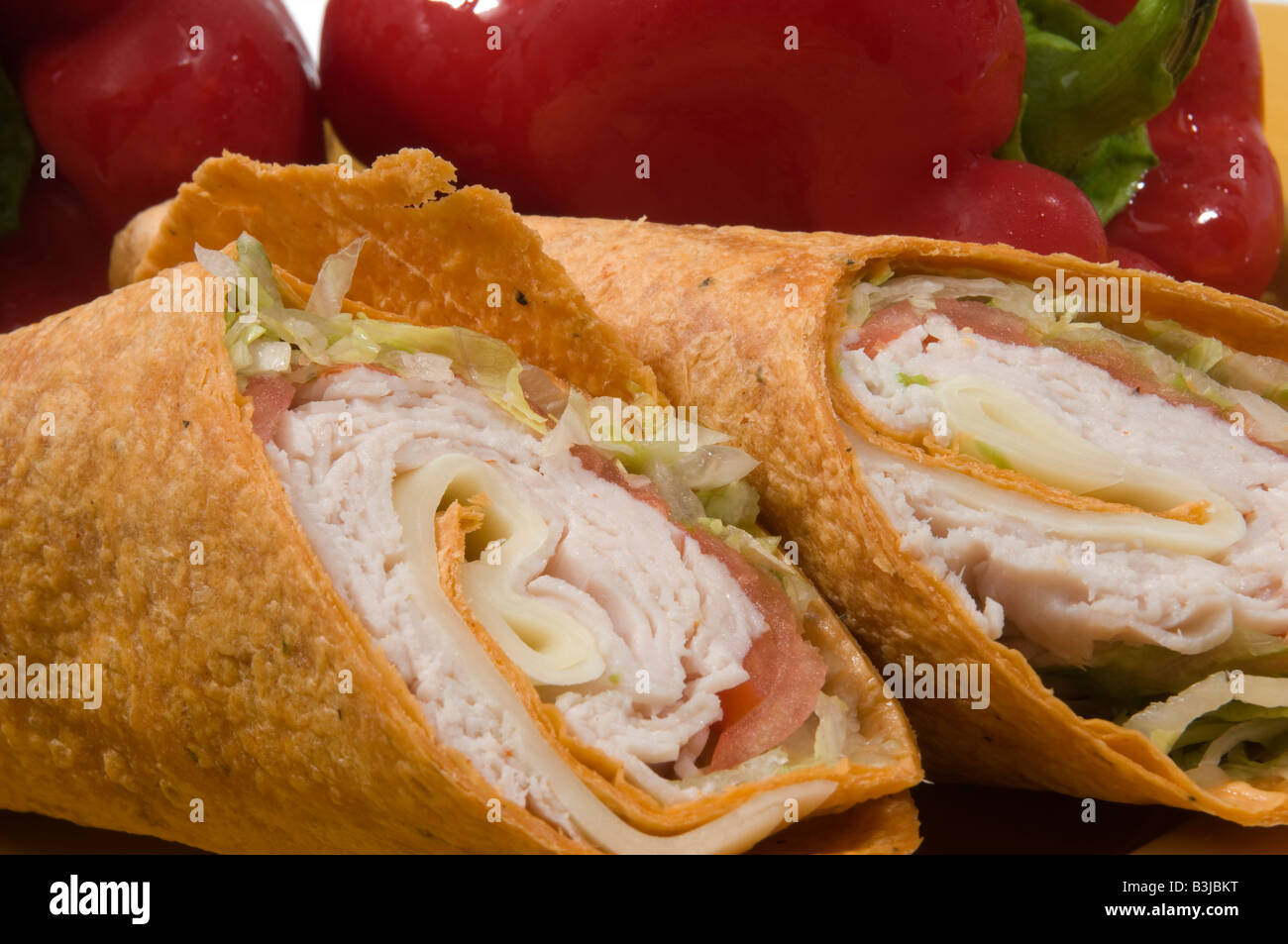 turkey and swiss cheese wrap sandwich with red bell peppers Stock Photo ...