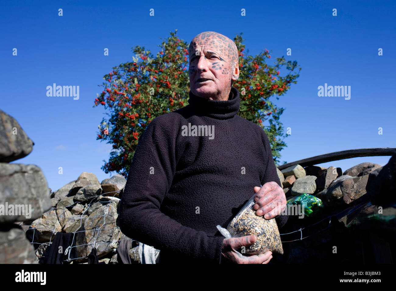 Tattooed hermit Tom Leppard clutches a bag of birdseed for local ...